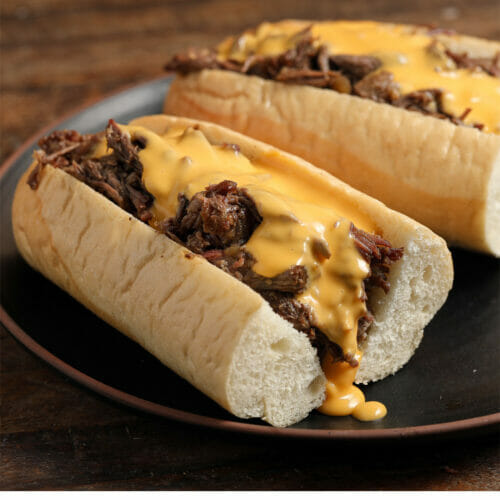 Pulled Beef Cheesesteak Sandwiches - The Salty Cooker – Flavorful ...